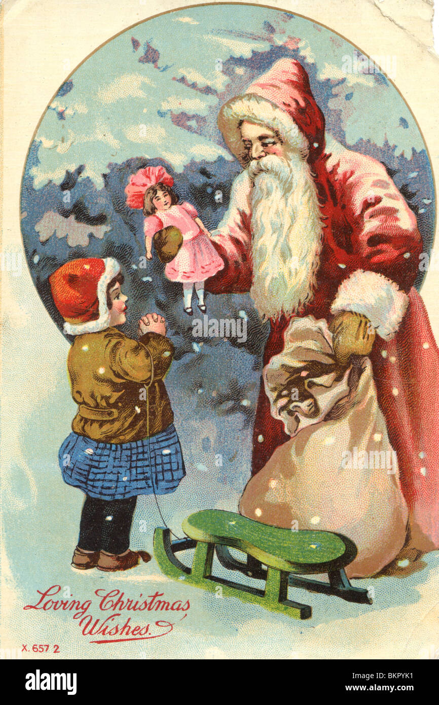Father Christmas Passes a Doll to the Little Girl Stock Photo - Alamy