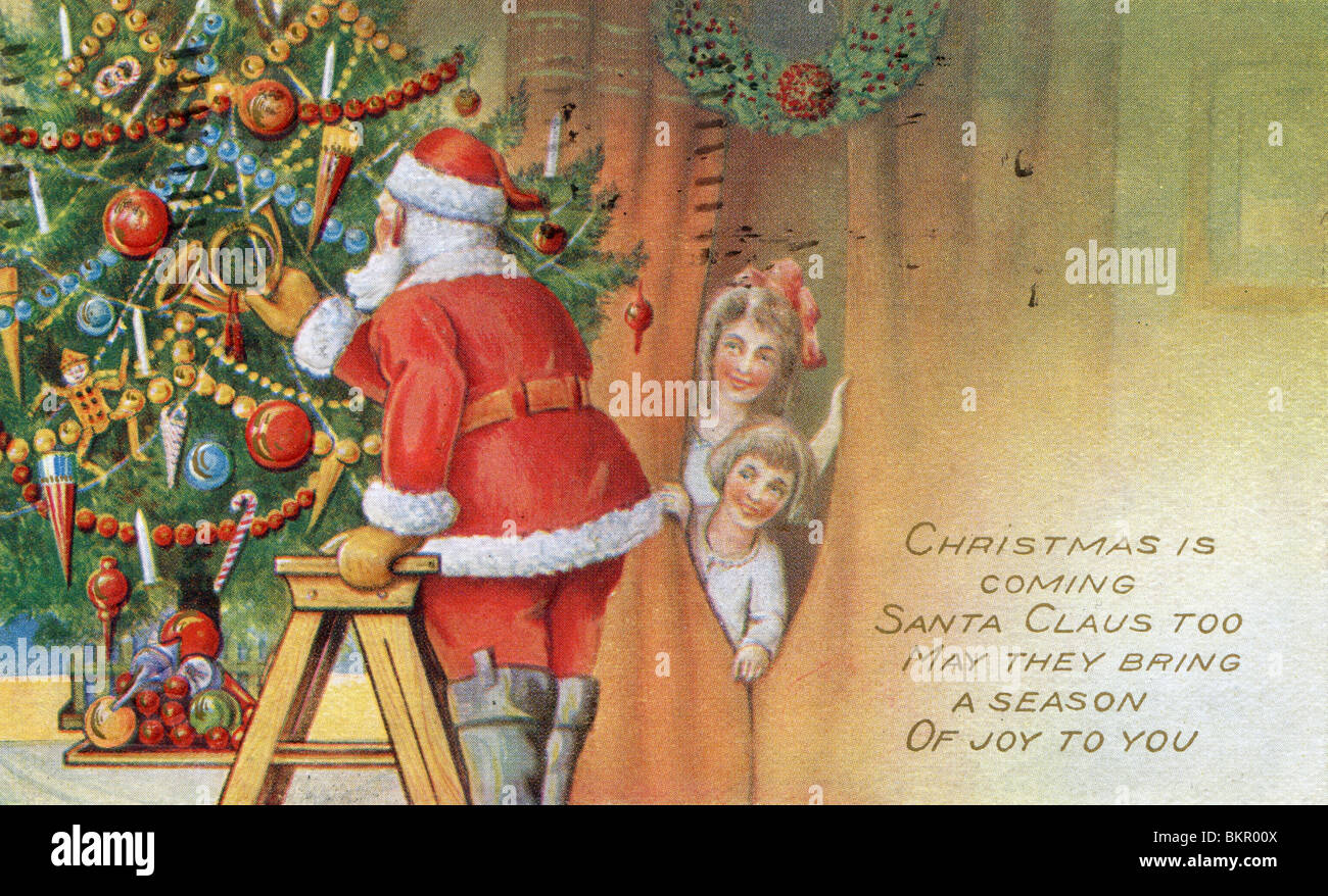 Father Christmas Decorating the Christmas Tree Stock Photo - Alamy