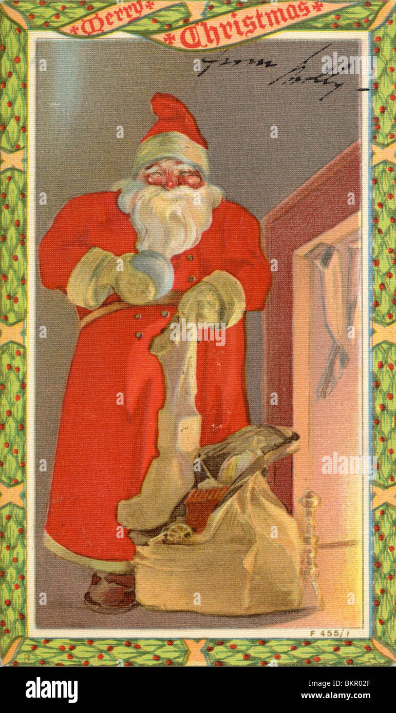 Santa filling stockings hi-res stock photography and images - Alamy