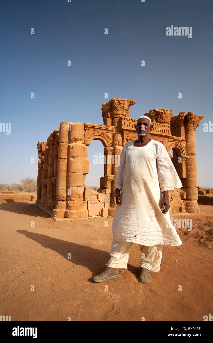 Sudan, Nagaa. The solitary guide at the remote ruins of Nagaa stands in ...