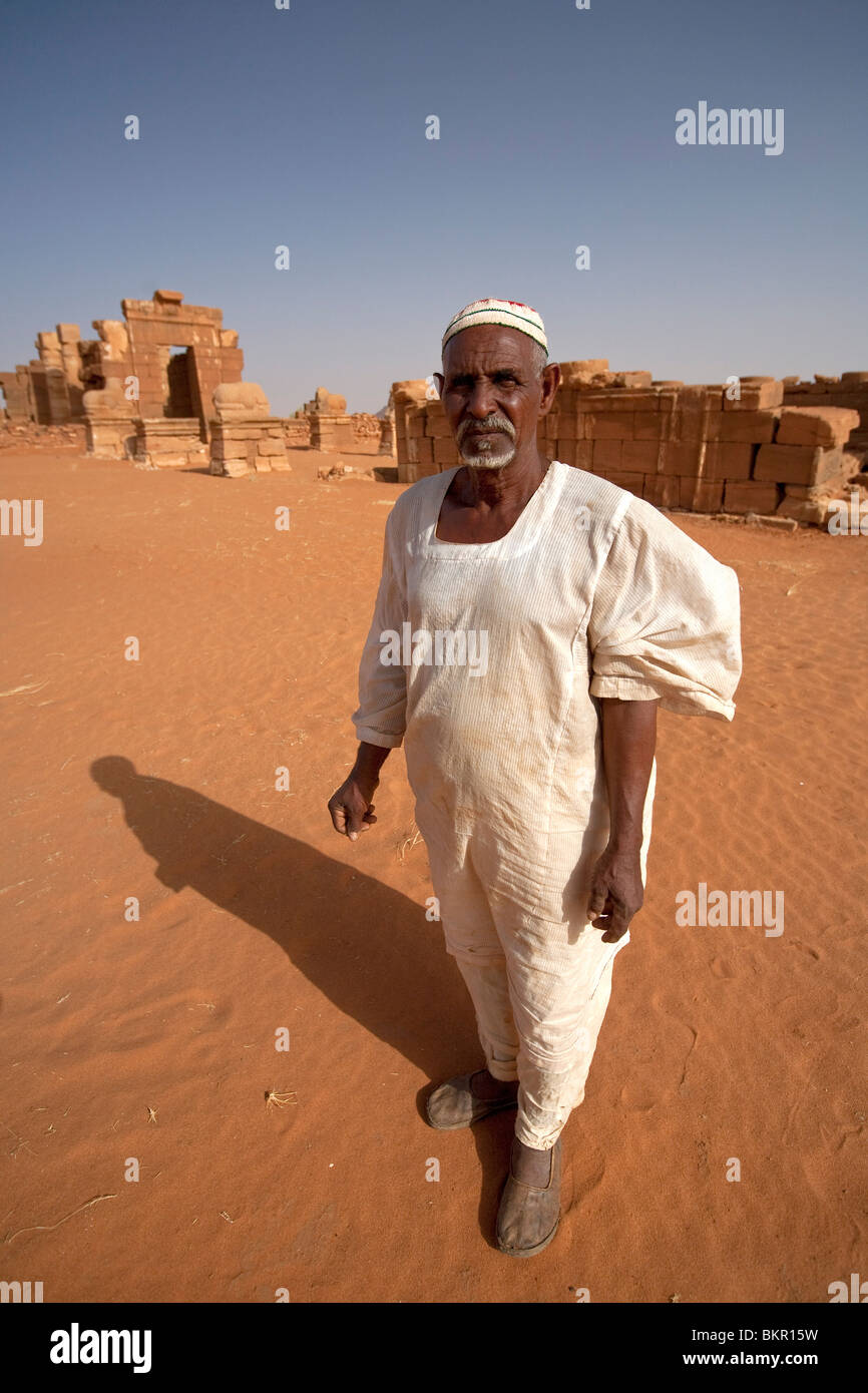 Sudan, Nagaa. The solitary guide at the remote ruins of Nagaa stands in ...