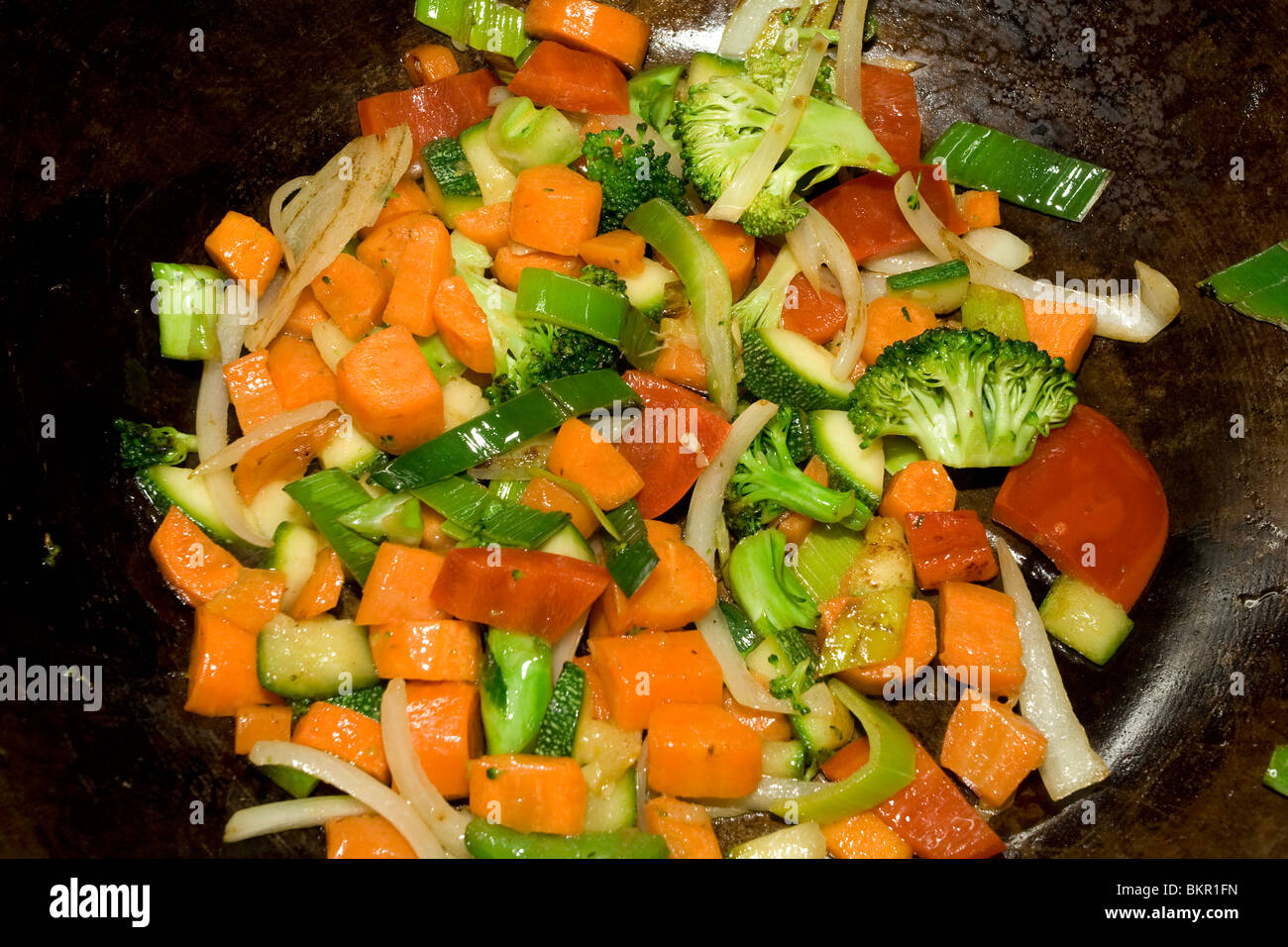 Vegetables in a frying pan Stock Photo - Alamy