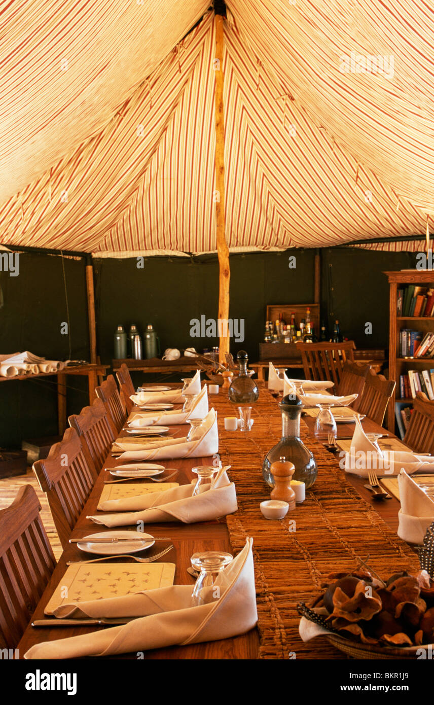 Tanzania, Katavi National Park. The mess tent at Chada Camp laid for ...