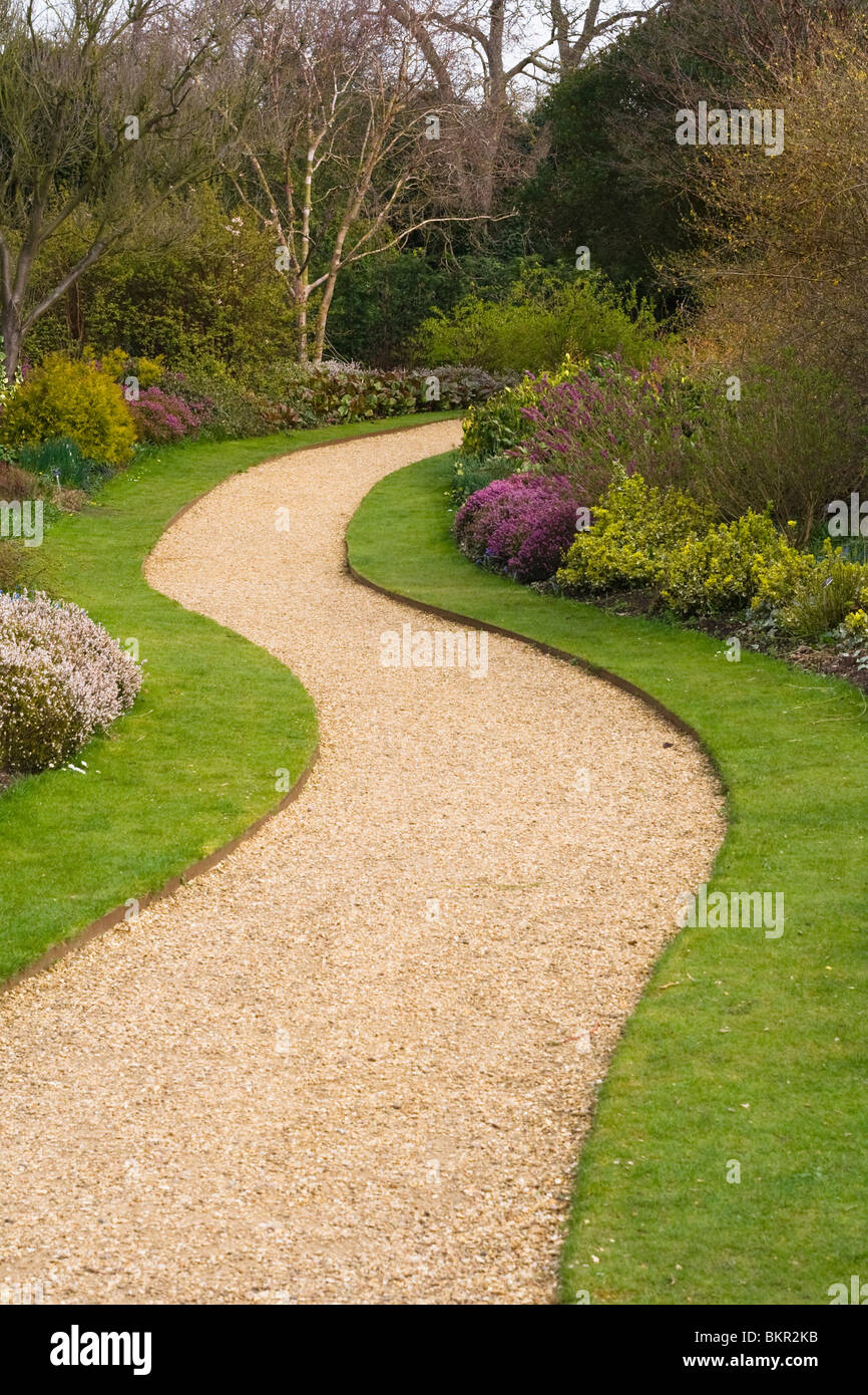 path on garden with bush and flowers Stock Photo - Alamy