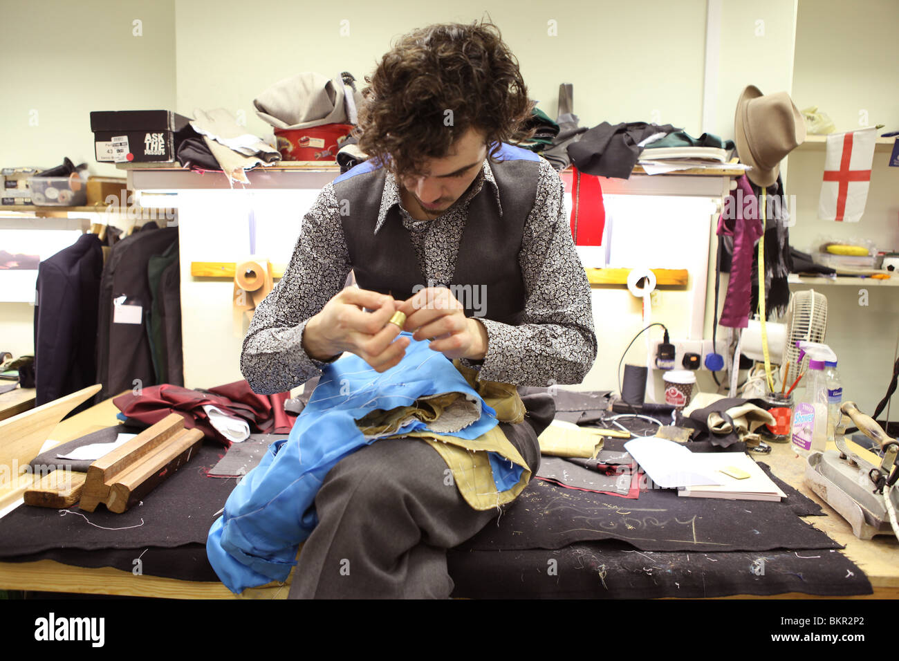A Tailor in the workshop of Henry Poole. Savile Row, London Stock Photo ...