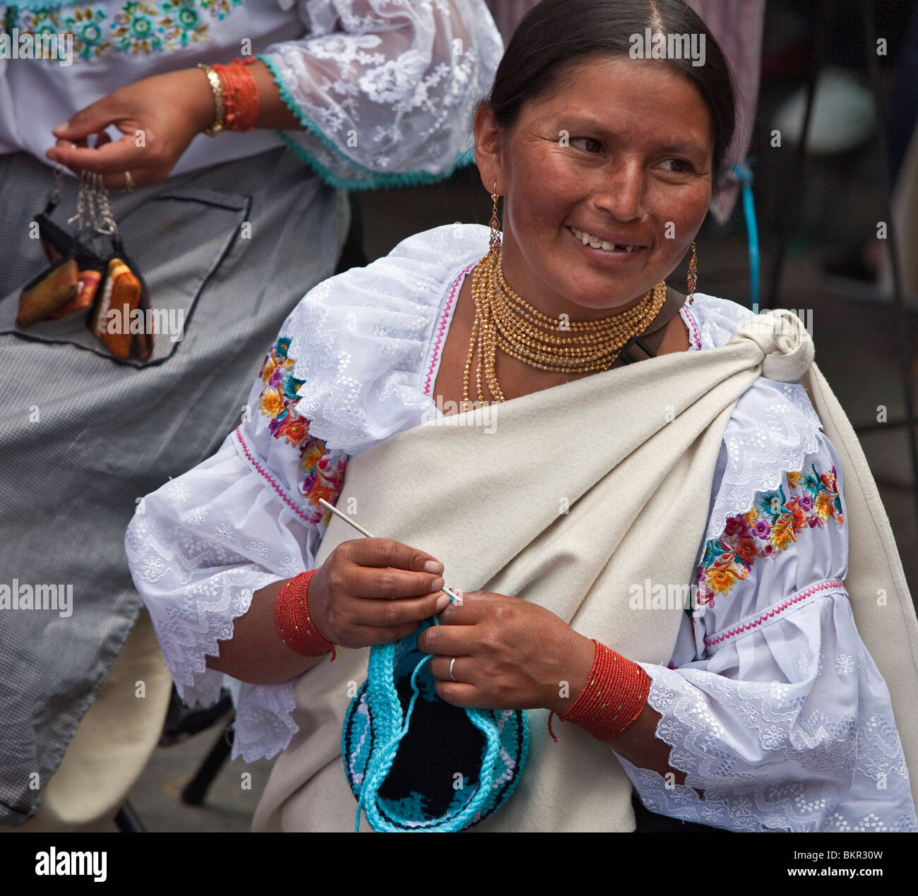 Ecuador, An indigenous Ecuadorian woman busy making a woollen hat at ...