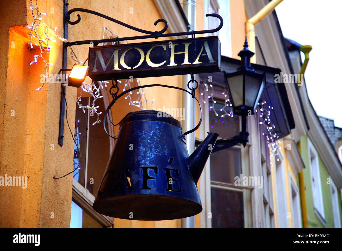 Estonia, Tallin; A coffee pot hung on a sign advertising a coffee shop ...
