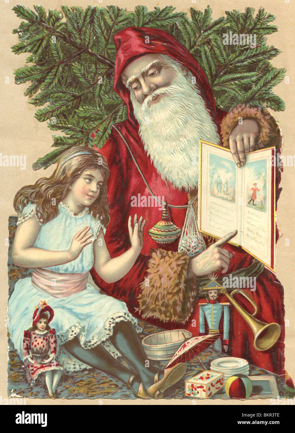 Father Christmas Reading a Book with Girl Stock Photo - Alamy