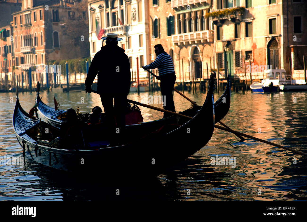 Italy, Veneto, Venice; Two gondolas moving through the Grand Canal ...