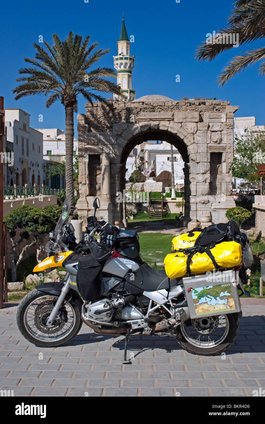 Libya, Tripoli. BMW motorbike in front of the Roman arch of Marcus ...