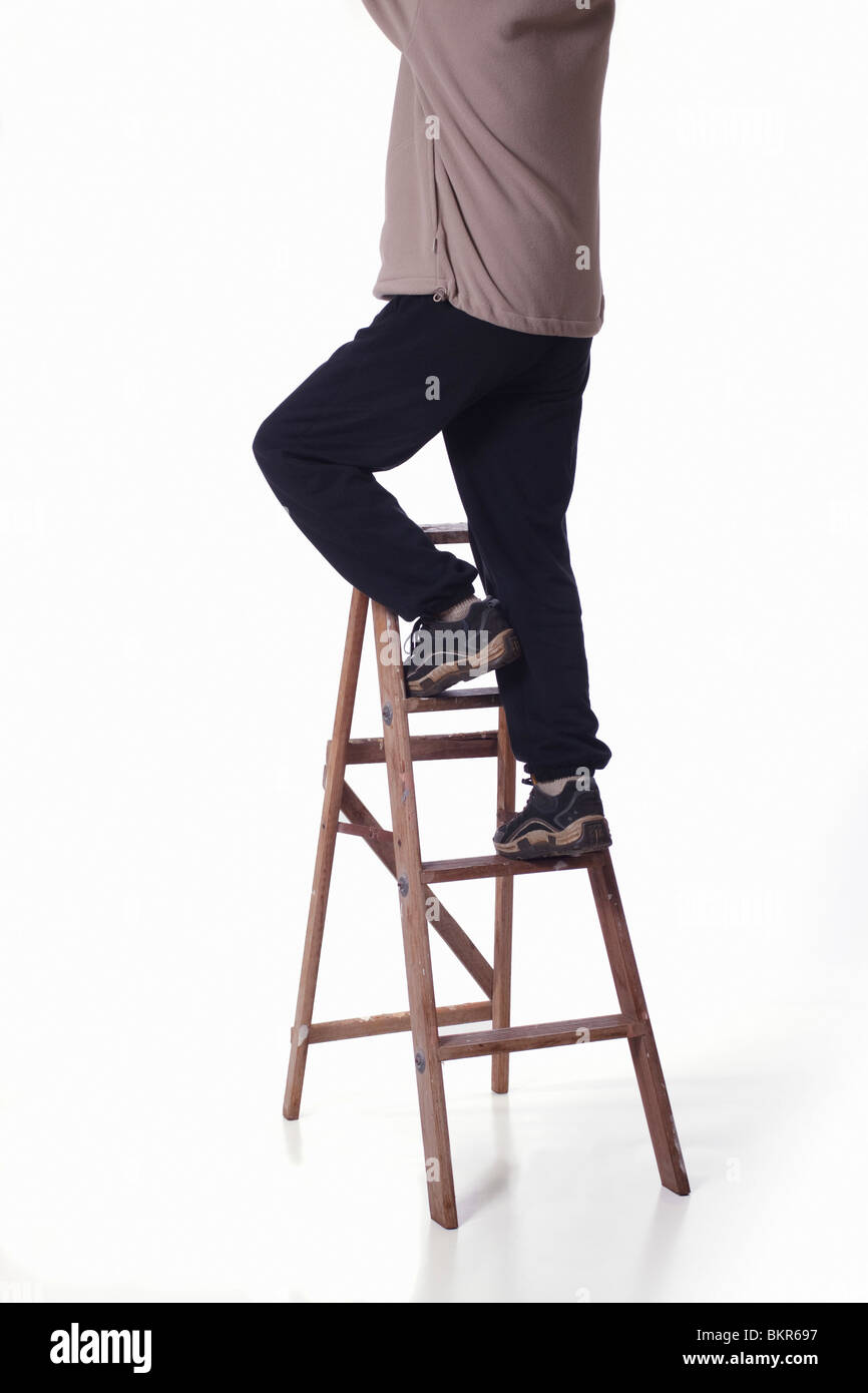 Side view of man on ladder reaching up. Isolated Stock Photo - Alamy