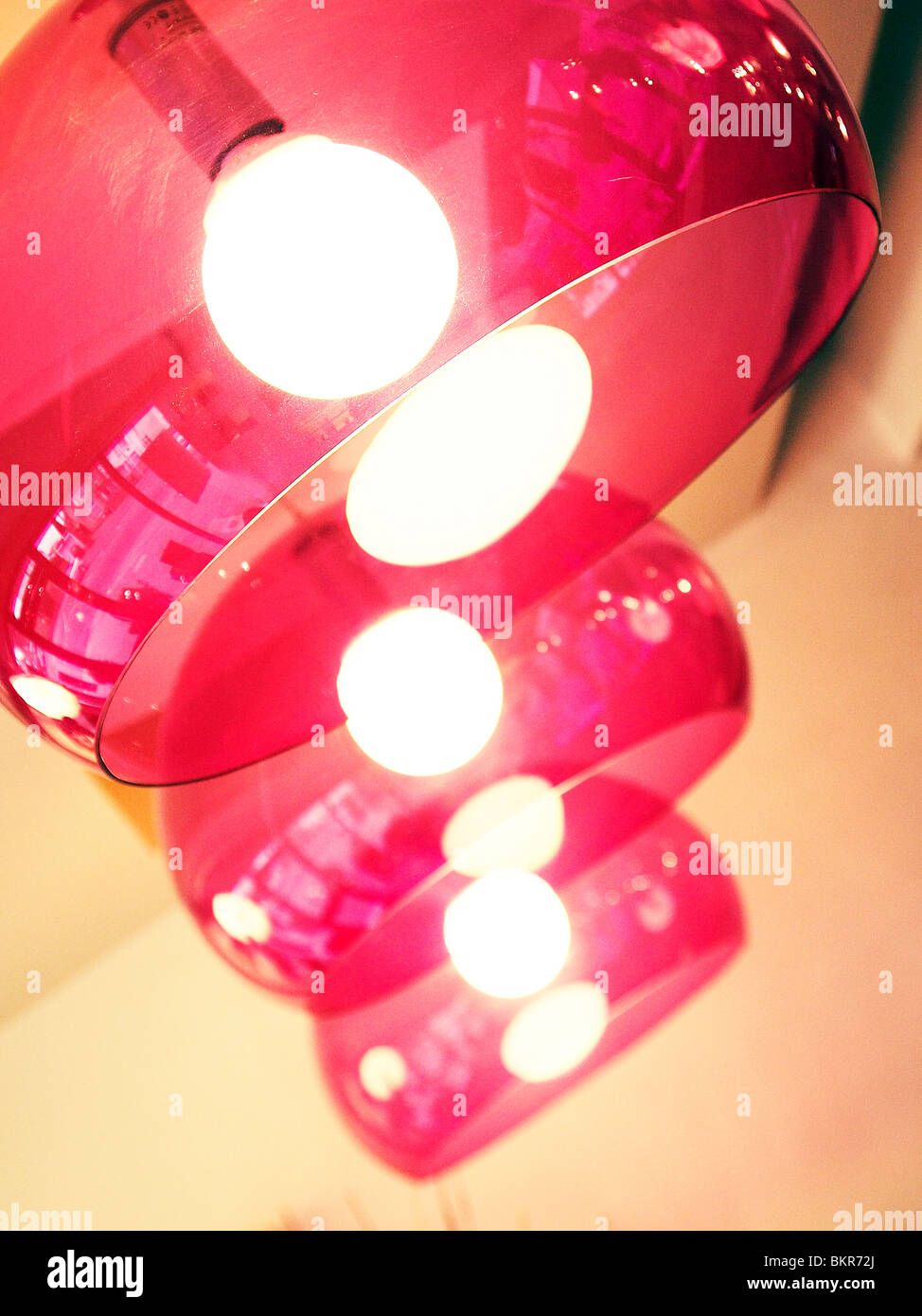 Close up of red glass light shades Stock Photo - Alamy