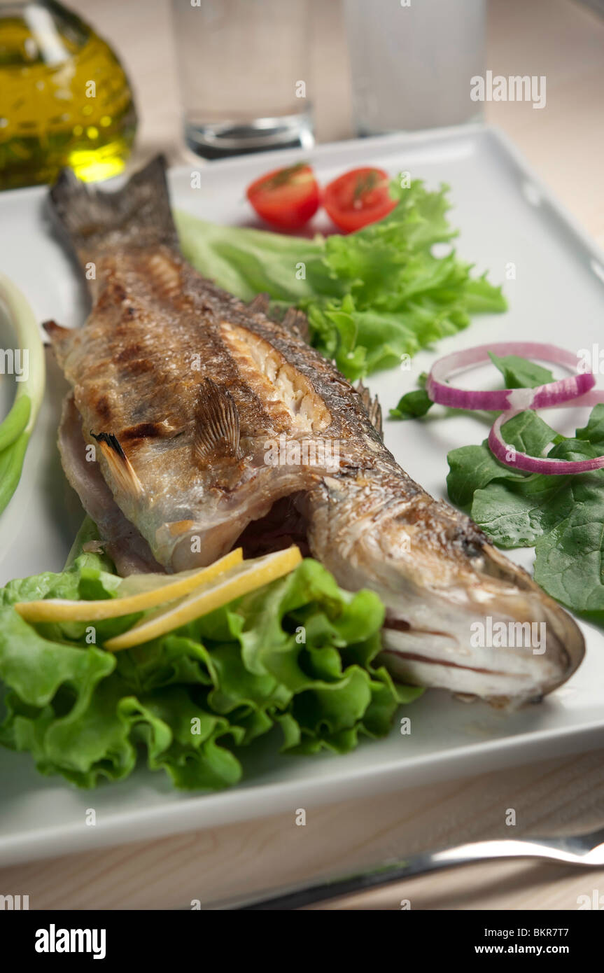 grilled sea bass on the plate Stock Photo - Alamy