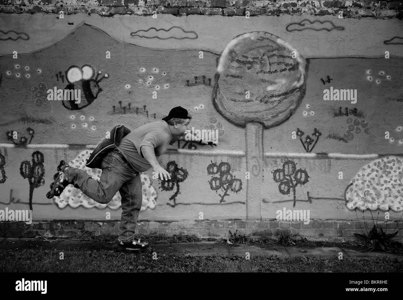 Passing large mural of cartoon background with bee chasing him Black ...