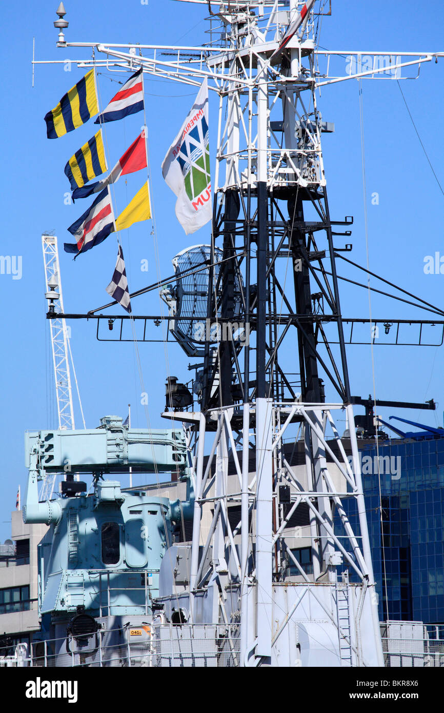 The main mast tower of HMS Belfast flying signals flags showing GGCN ...