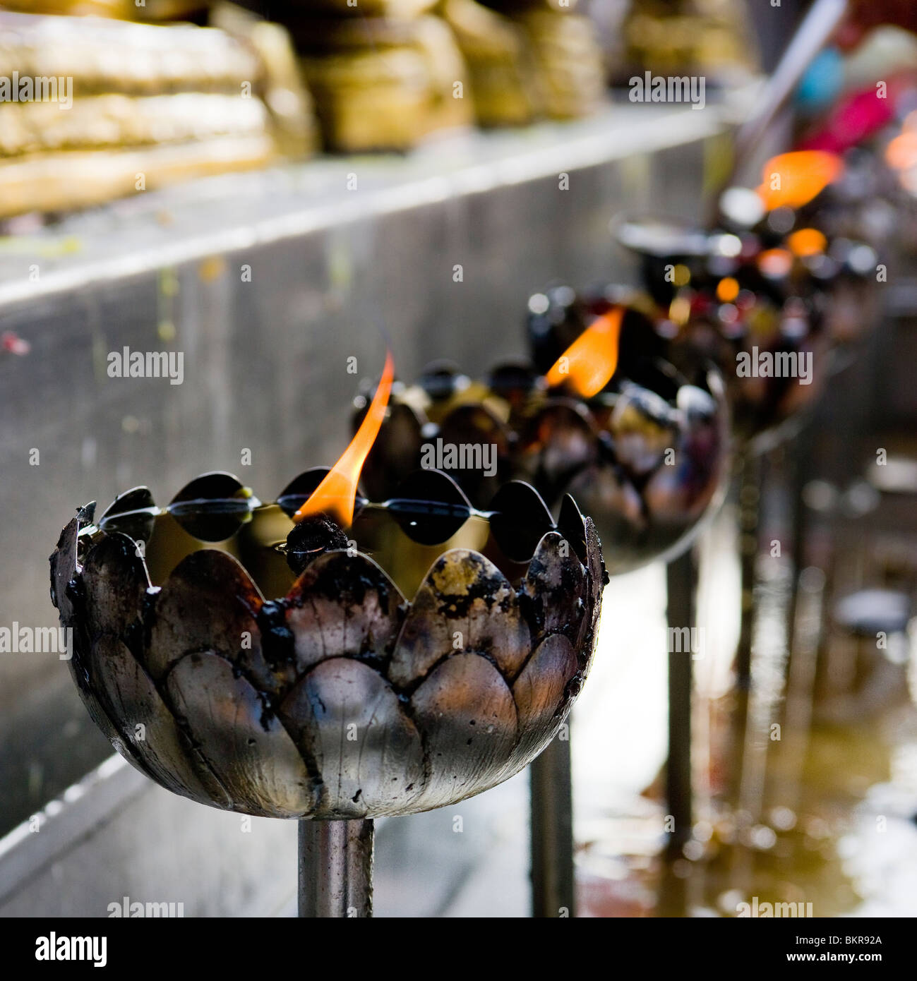 Religious flames at Buddhist temple, Chiang Mai, northern Thailand ...