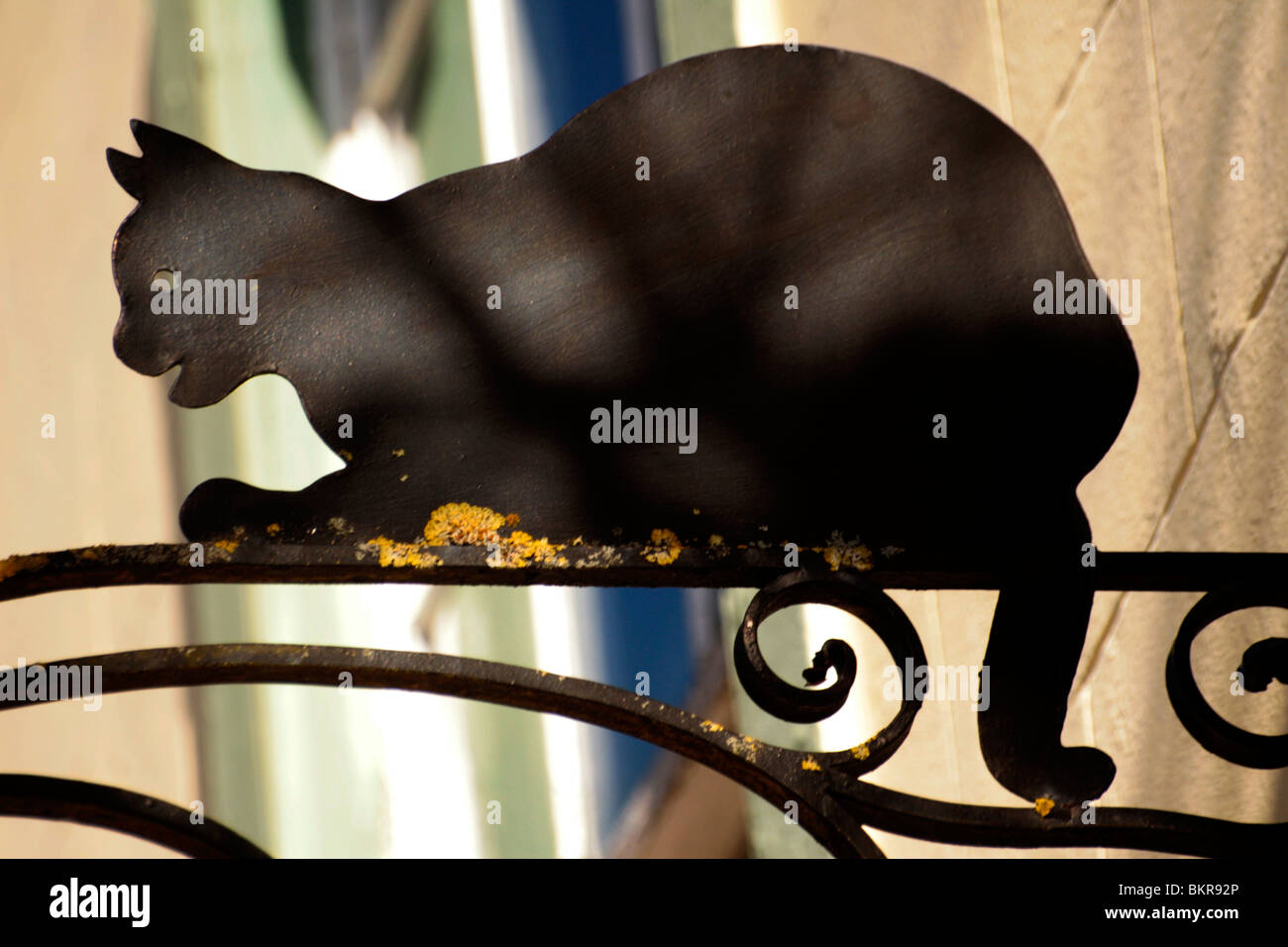 Advertising sign depicting a black cat Stock Photo - Alamy