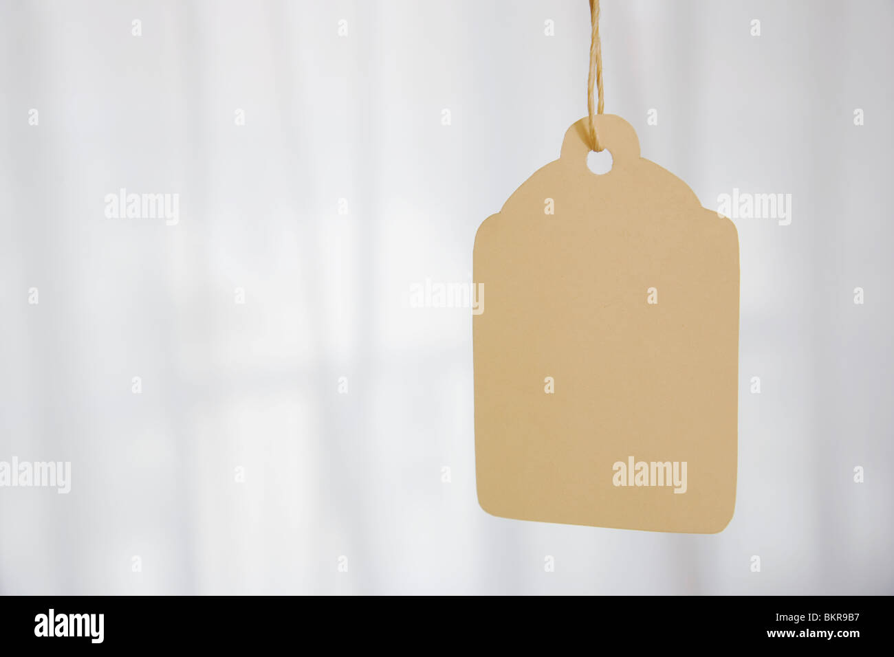 A Tag On A String Stock Photo - Alamy