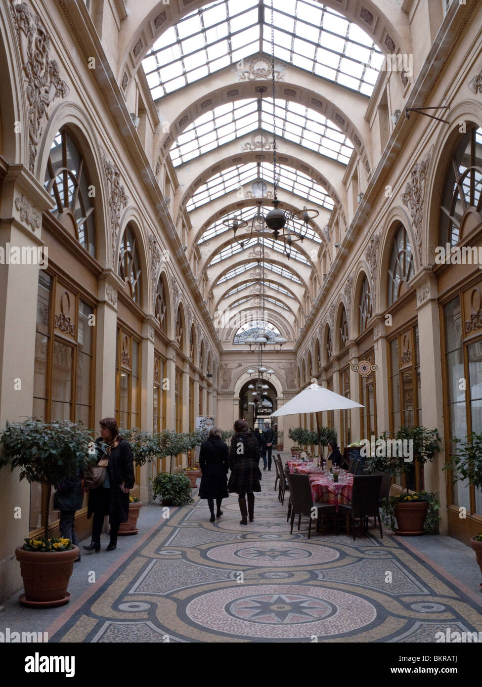 The covered walkway of the Galerie Vivienne shopping arcade in Paris ...