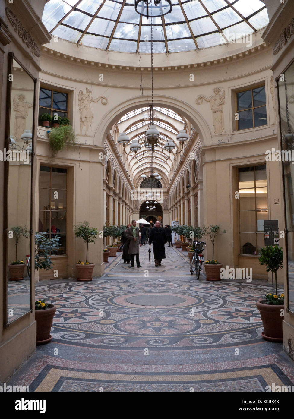 The covered walkway of the Galerie Vivienne shopping arcade in Paris ...