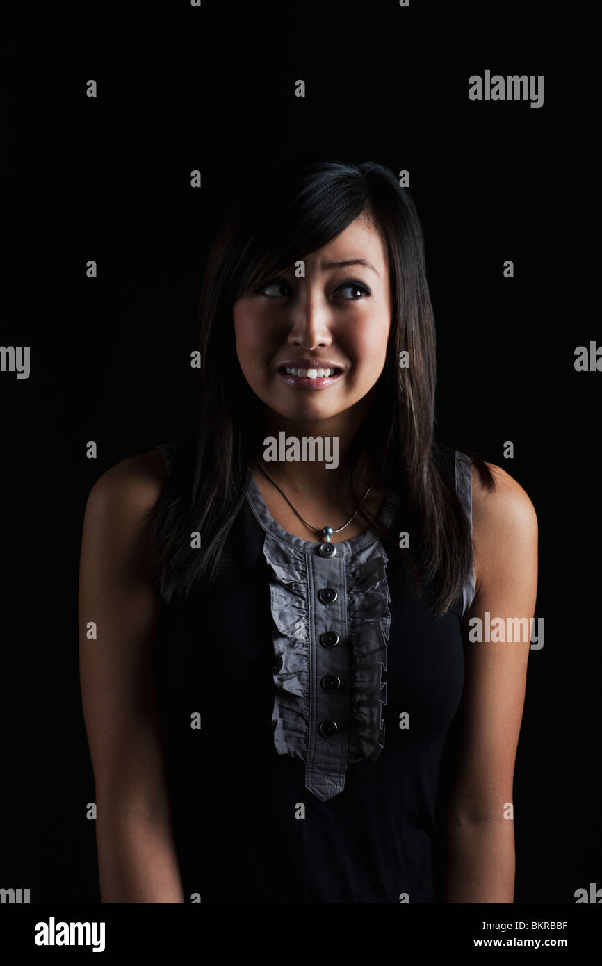 A Young Woman With A Fearful Look On Her Face Stock Photo - Alamy