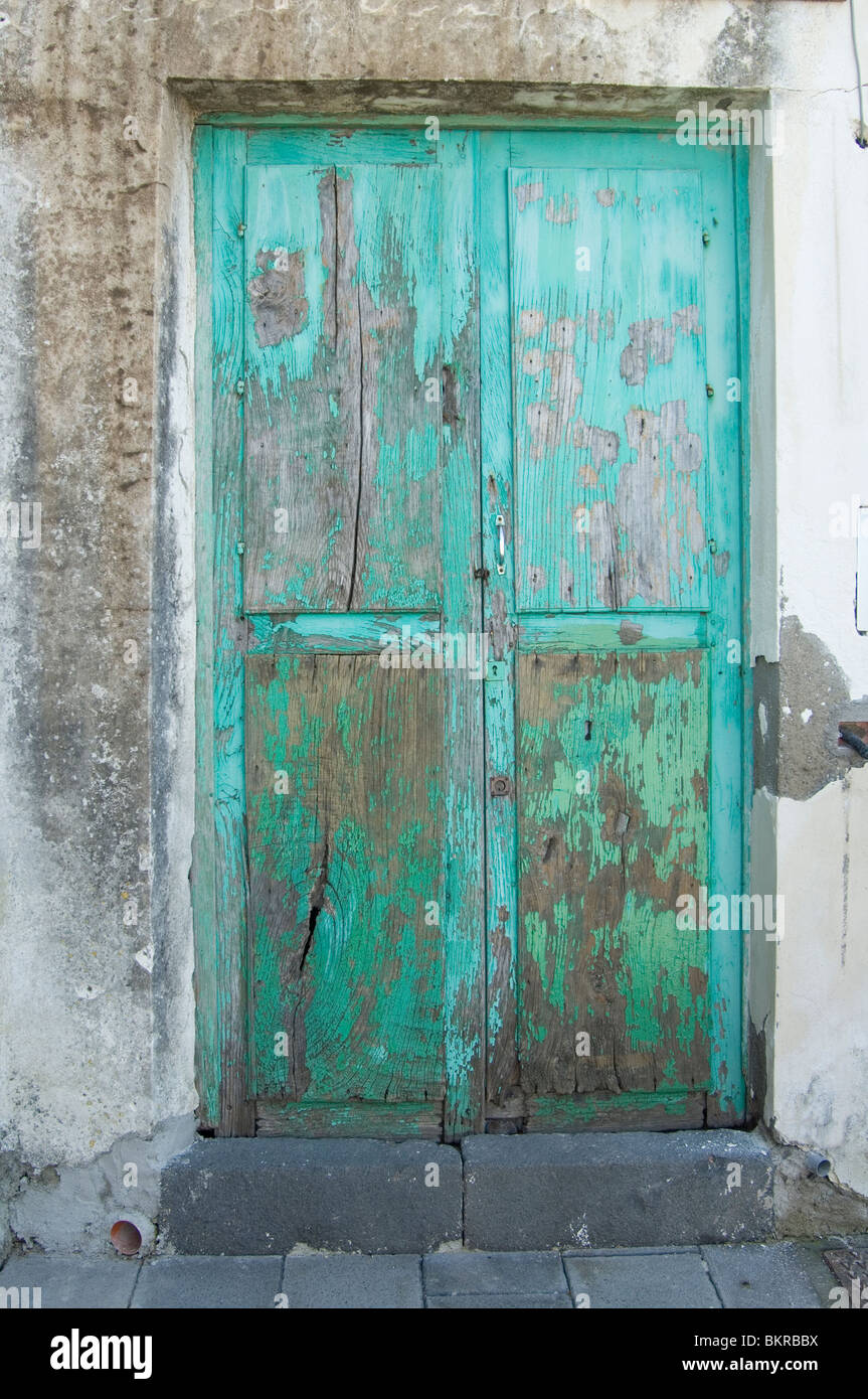 faded and flaking wooden green door in Salina Aeolian Islands Stock ...