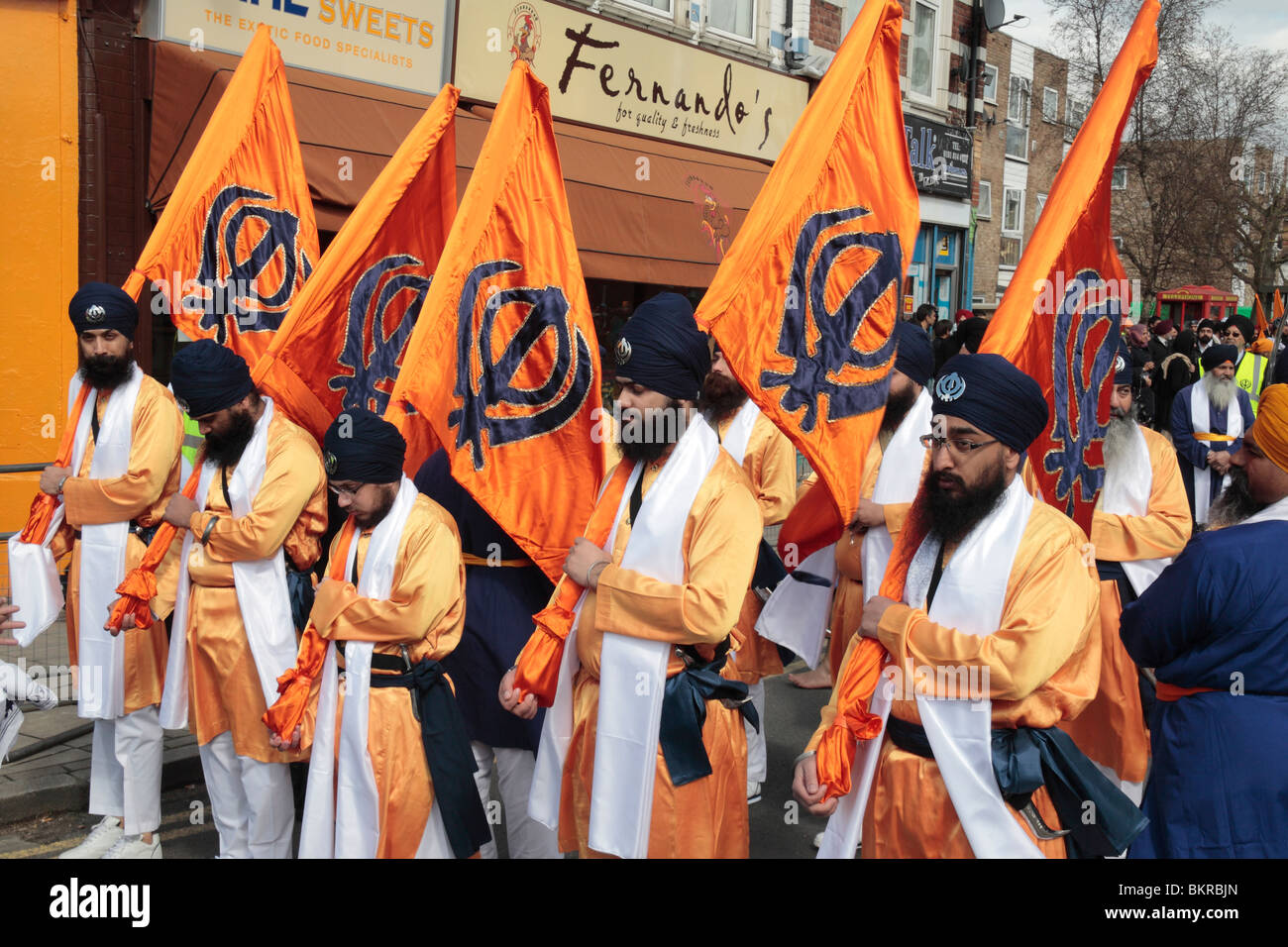 Five young men carrying khalsa flags at the head the 12th annual ...