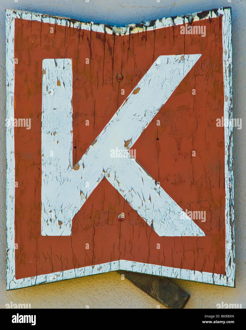 A red sign with the letter K Stock Photo - Alamy