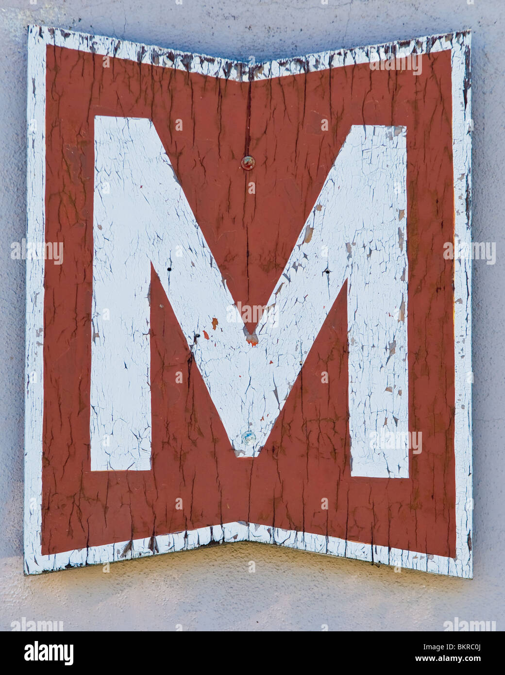 A red sign with the letter M Stock Photo - Alamy