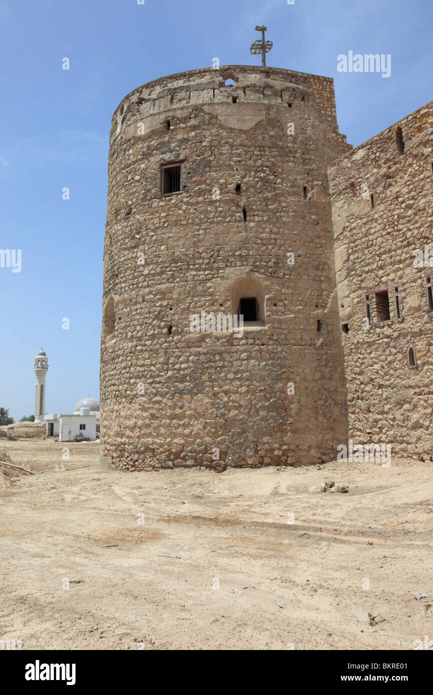restored tower and outside fortified wall of Al-Musanah Castle in Al ...