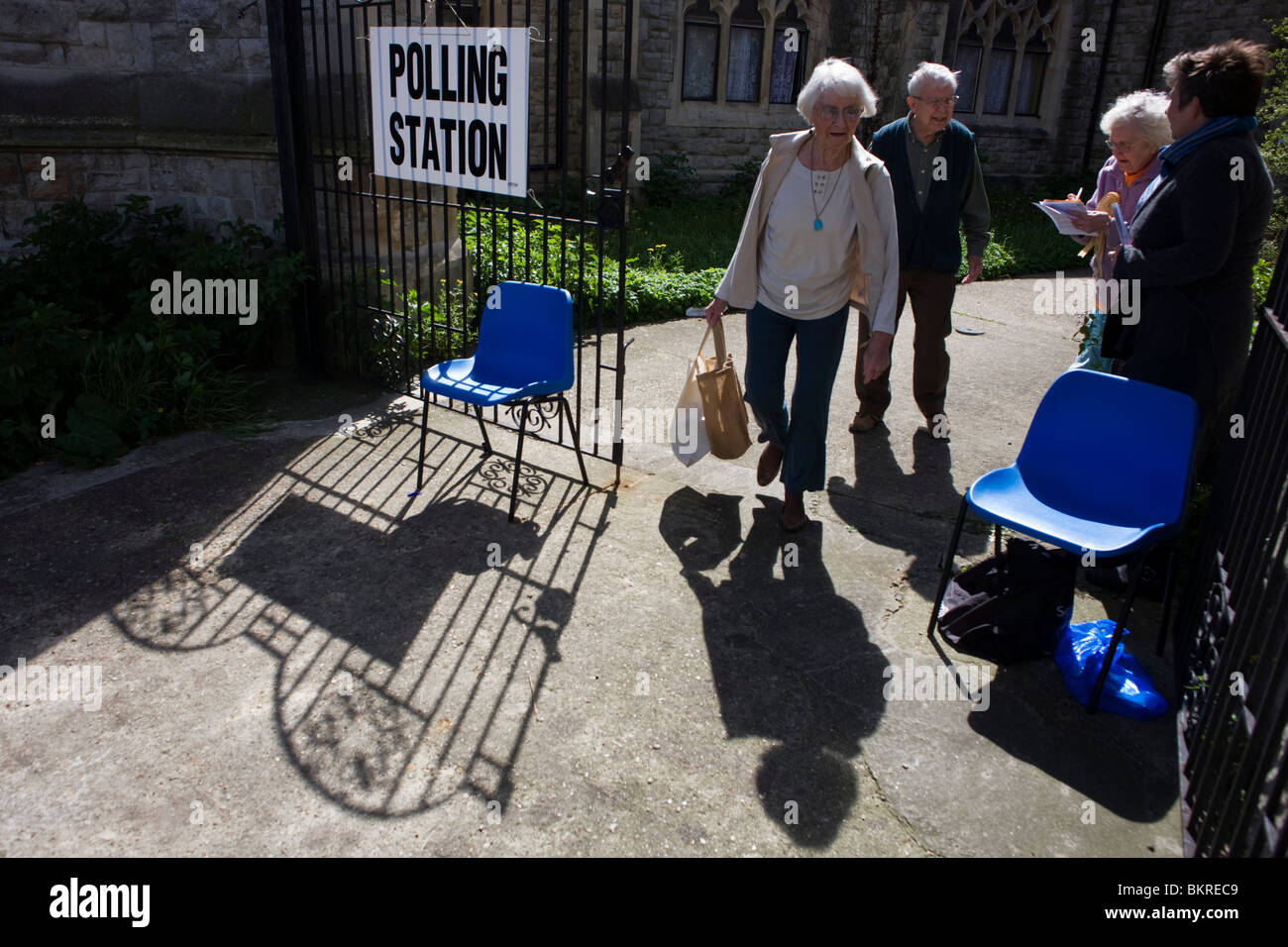 Two tellers log the election numbers and addresses of voters as they ...