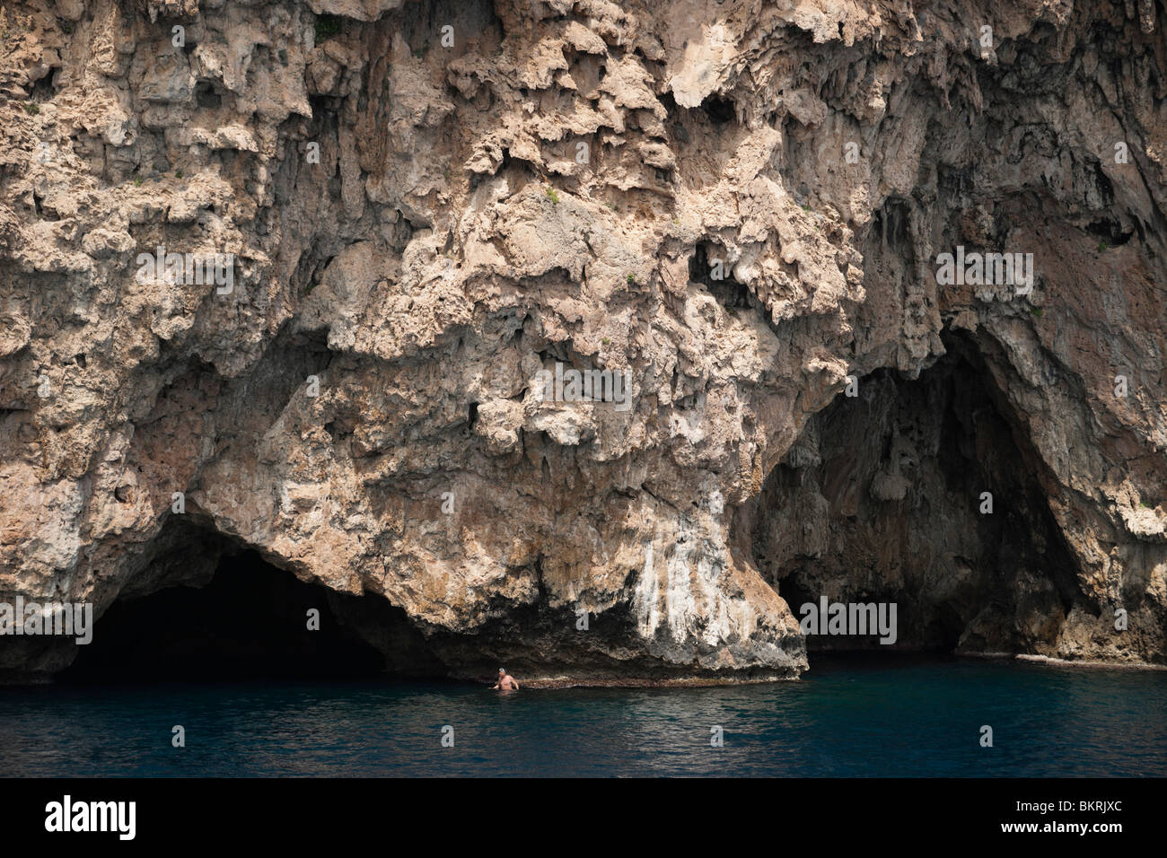 Swimmer at the entrance to Phosphor Cave, Antalya, Turkey Stock Photo ...