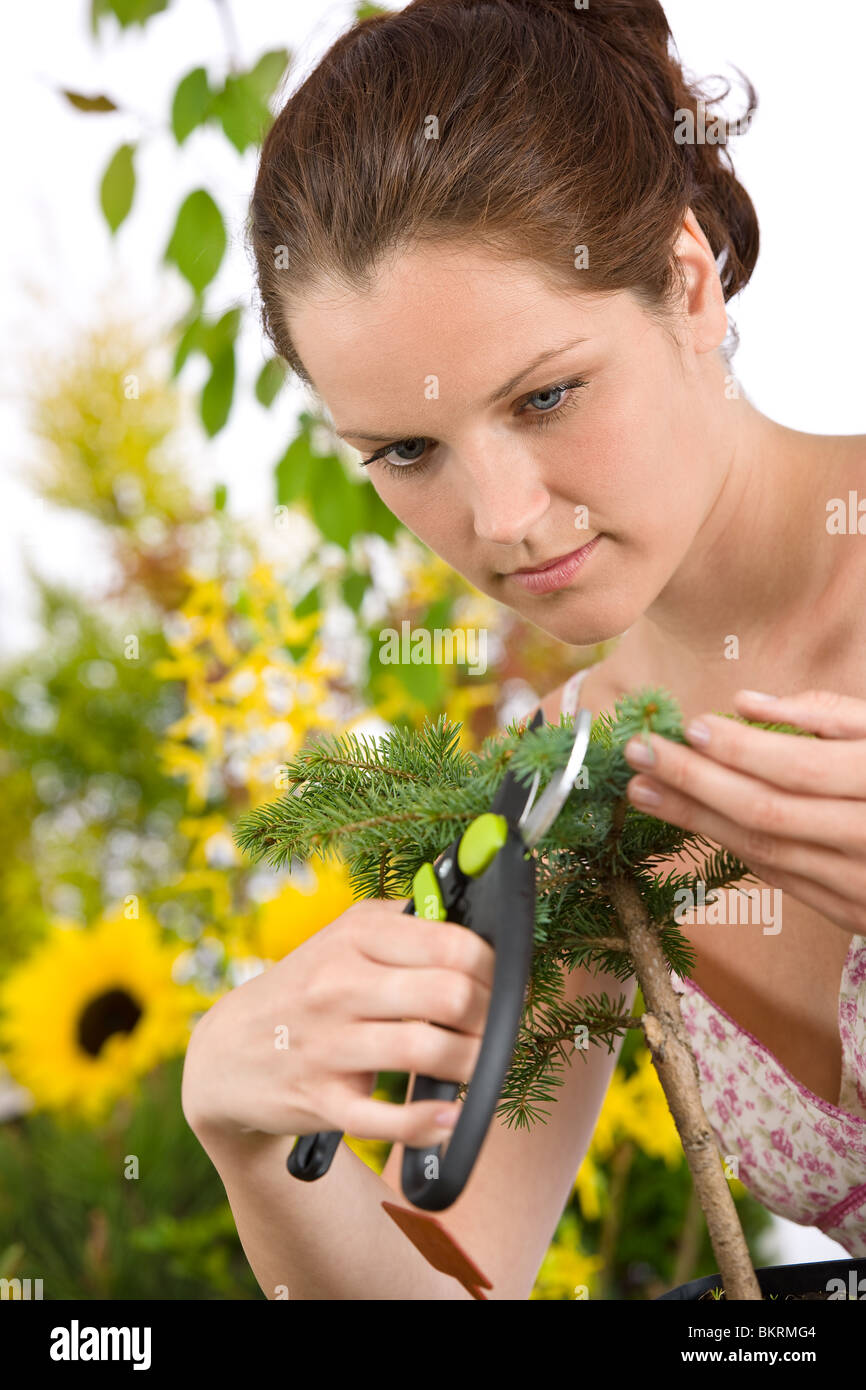 Gardening - woman cutting tree with pruning shears on white background ...