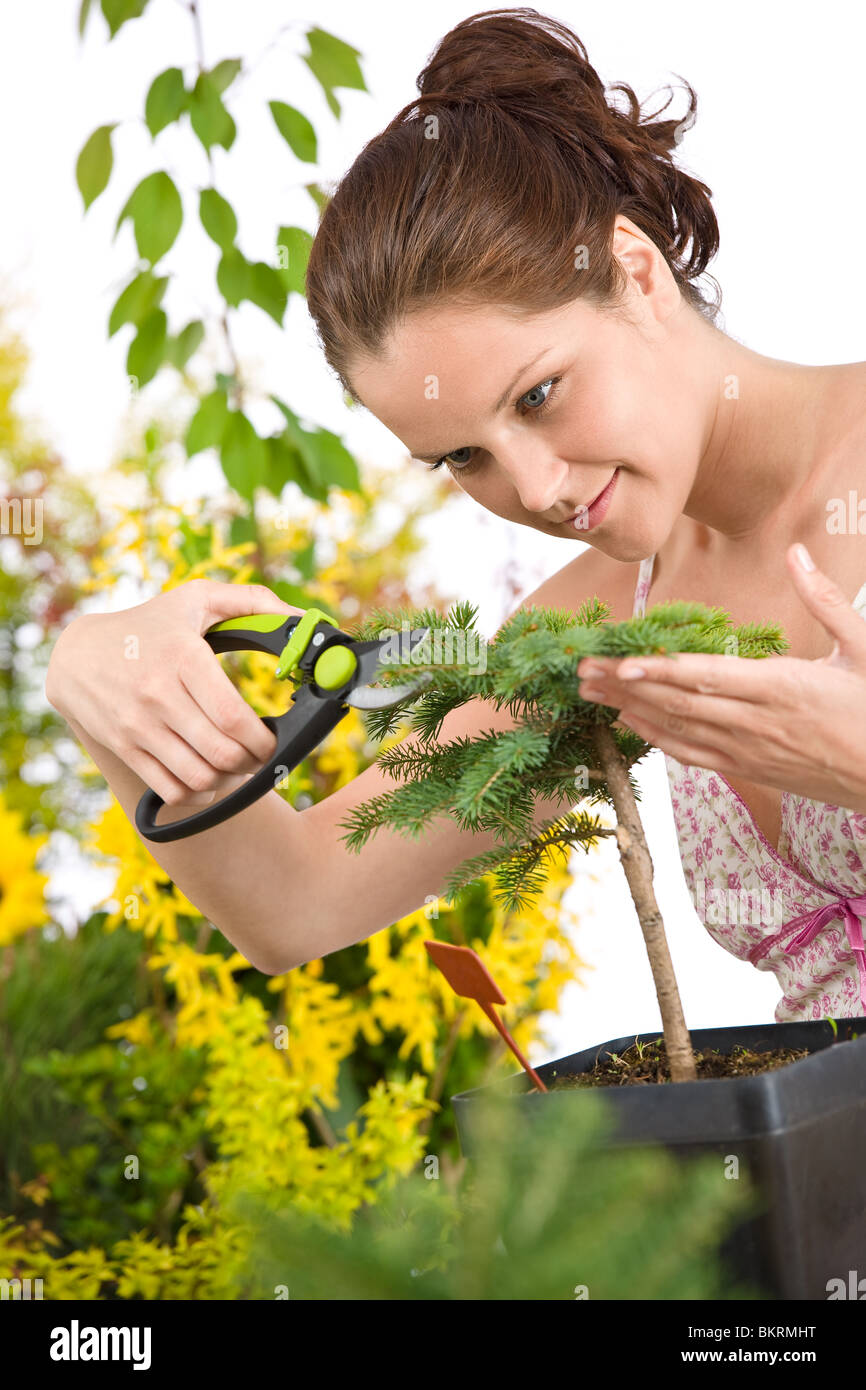 Gardening - woman cutting tree with pruning shears on white background ...