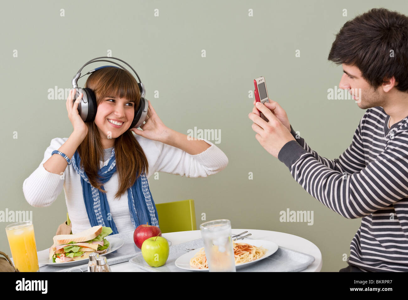 Student cafeteria - Teenagers having lunch break, taking photo Stock ...