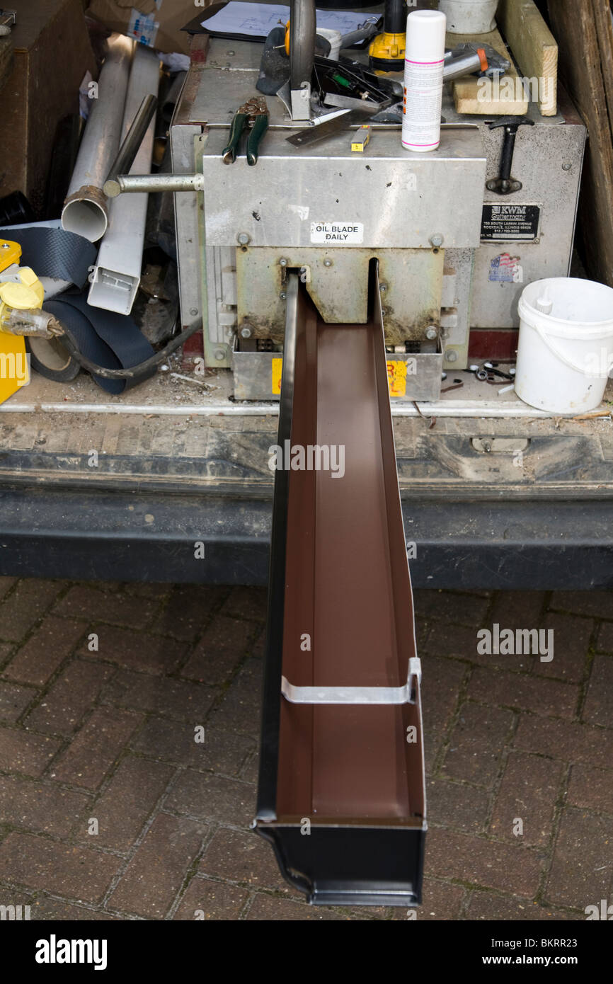 Start of a length of seamless replacement gutter / guttering being ...