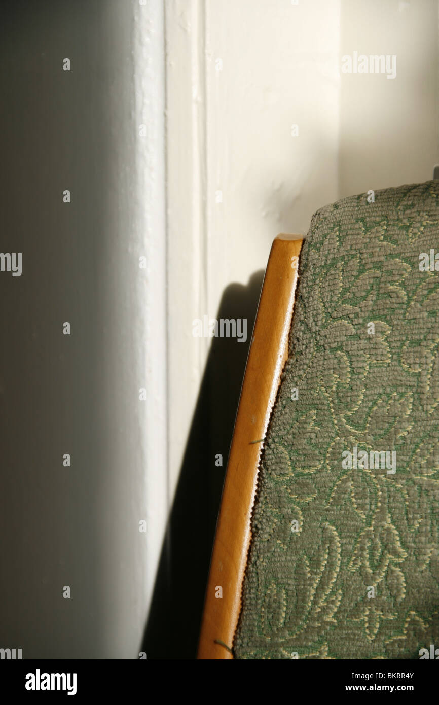 detail of one empty chair with floral design in room Stock Photo - Alamy