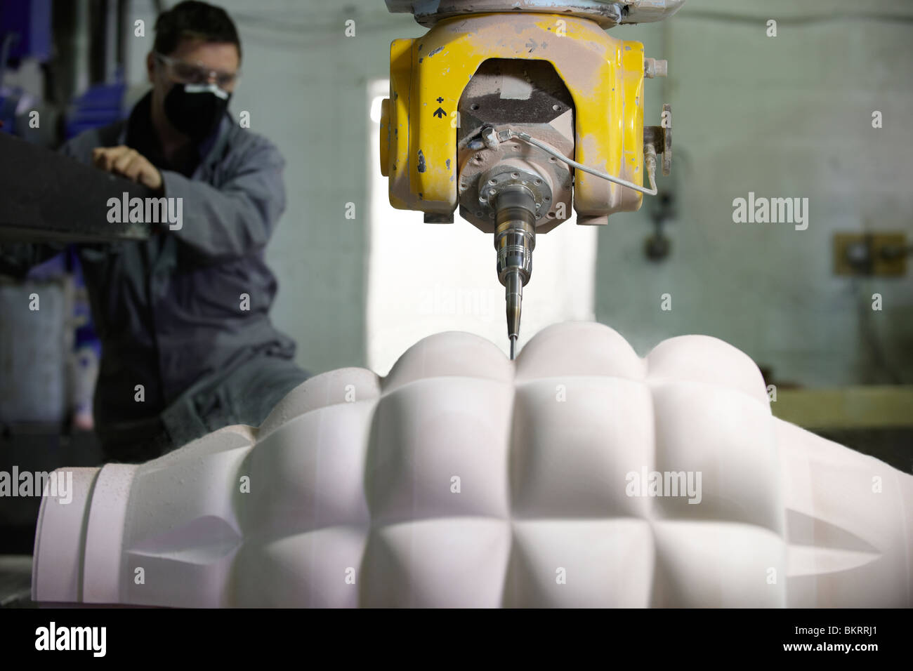 worker controlling a multi axis milling machine Stock Photo - Alamy