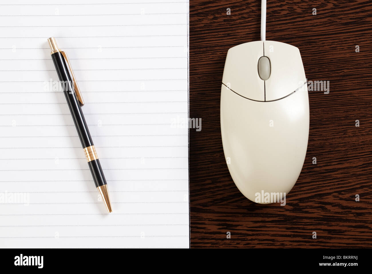the computer mouse and pen with paper Stock Photo - Alamy