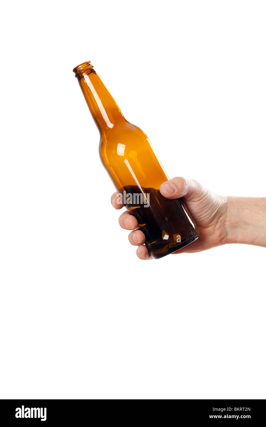 glass bottle in hand isolated on white background Stock Photo - Alamy