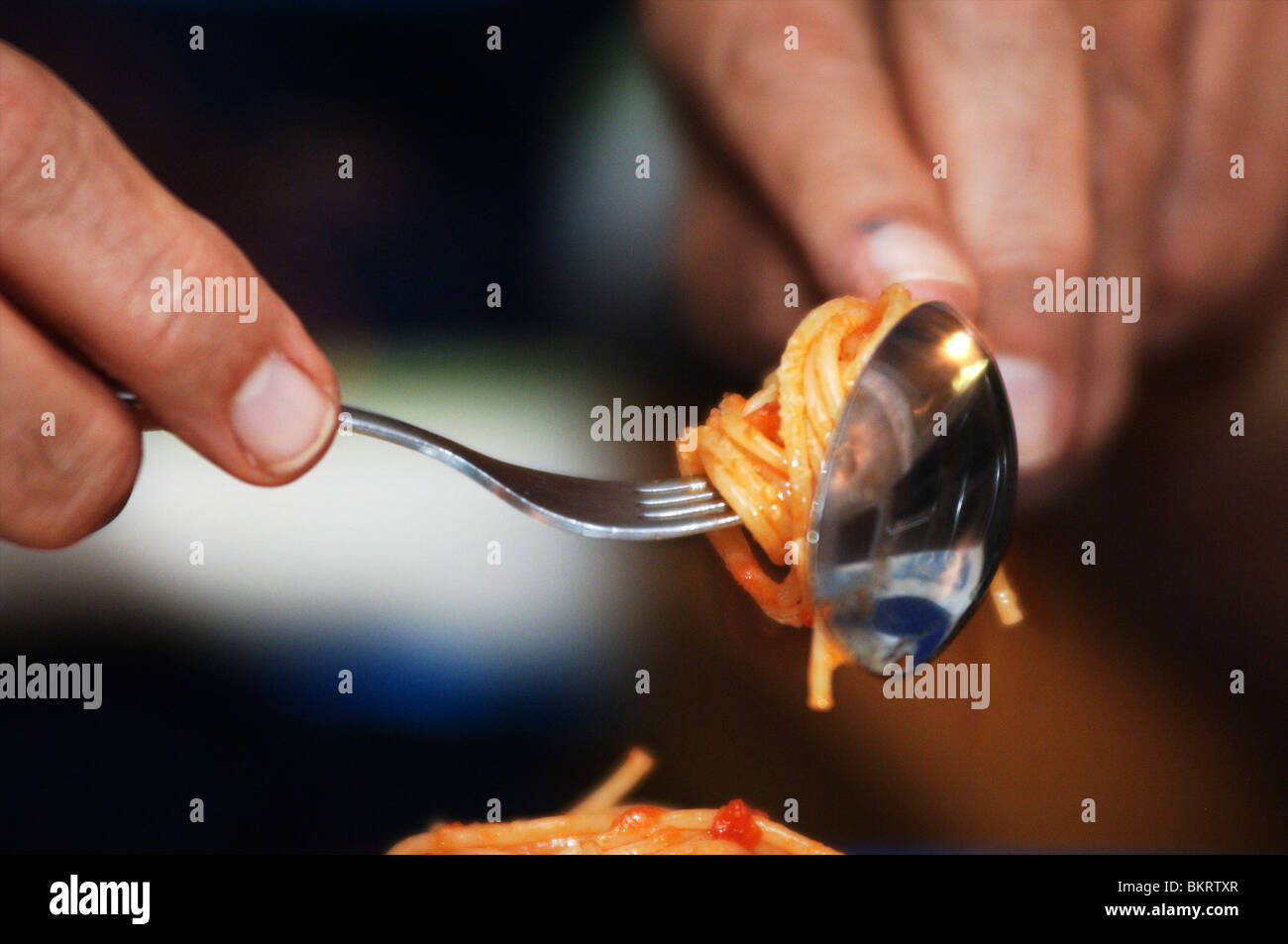 eating spaghetti italian style Stock Photo - Alamy