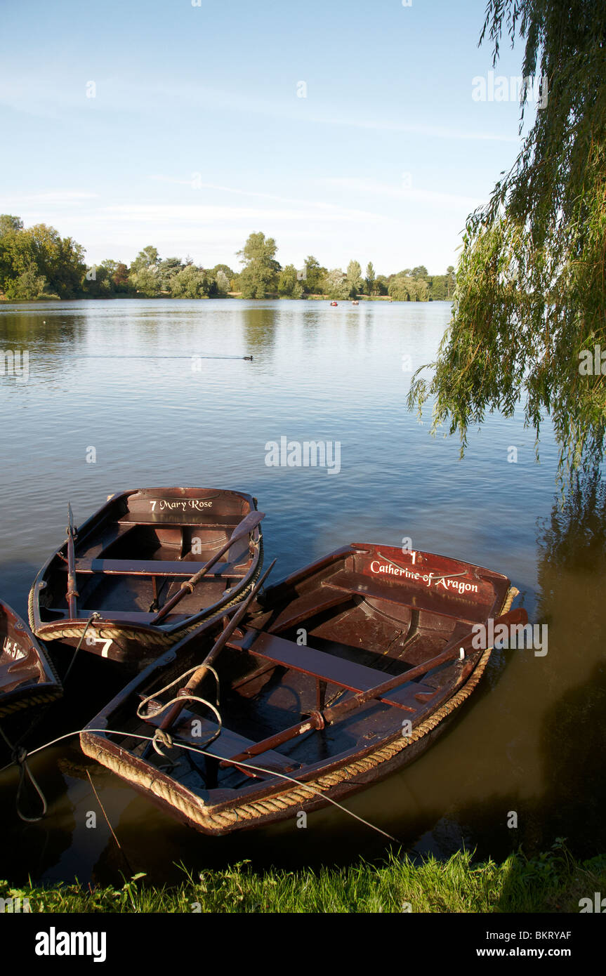 Row boats by the side of a lake Stock Photo - Alamy