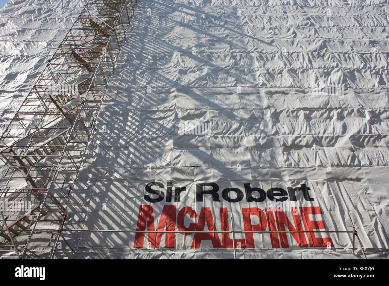Protective sheeting surrounds tall building project by McAlpine in ...