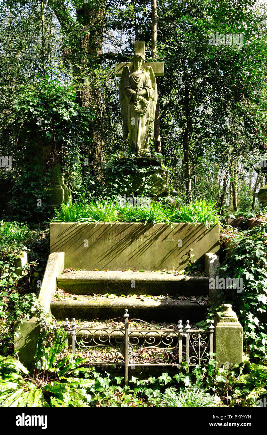 Victorian stone angel statue on tomb in Highgate Cemetery West, London ...