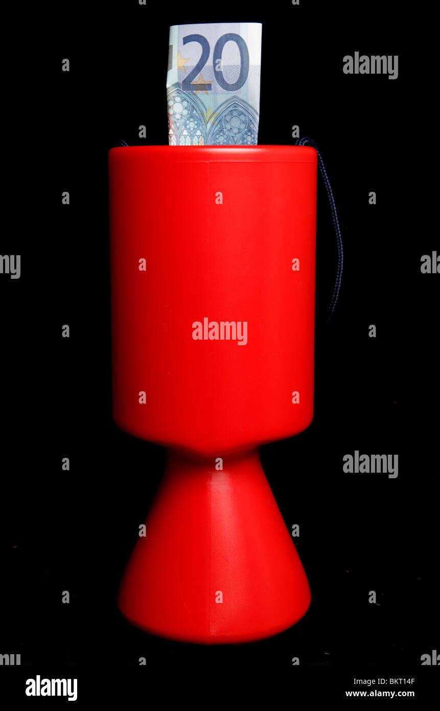 charity collection tin with twenty euros Stock Photo - Alamy