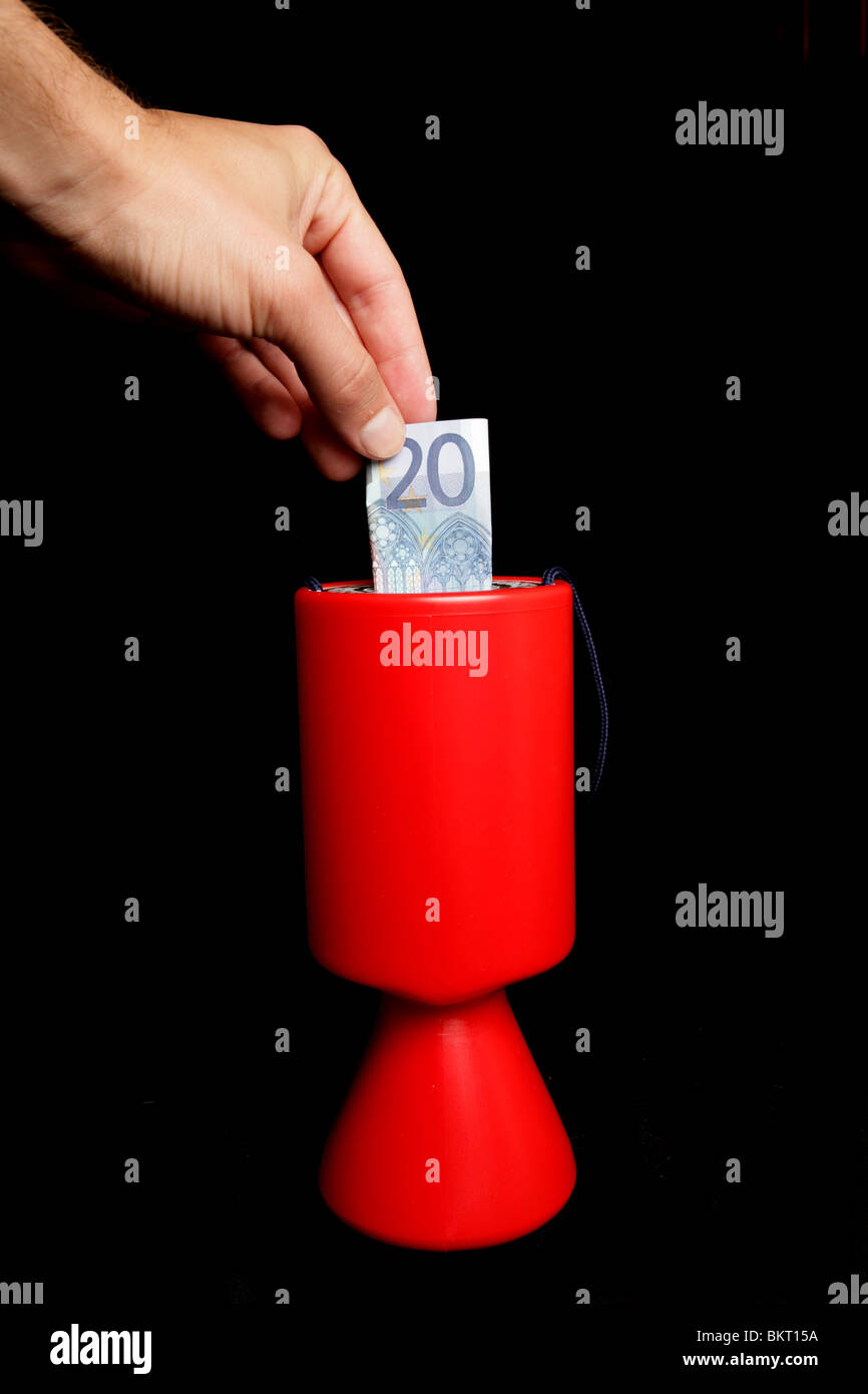 charity collection tin with twenty euros Stock Photo - Alamy