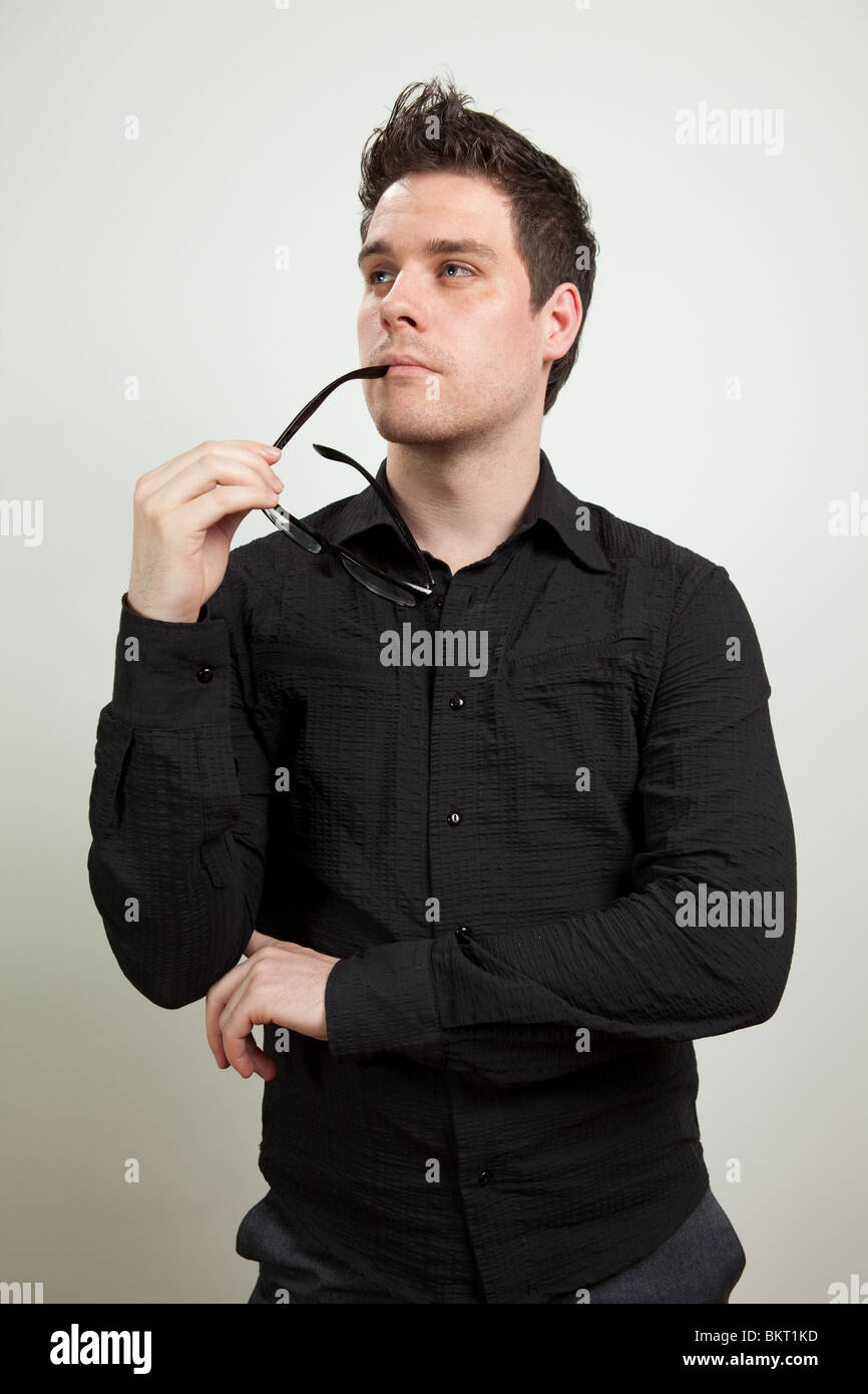 Young man standing Stock Photo - Alamy