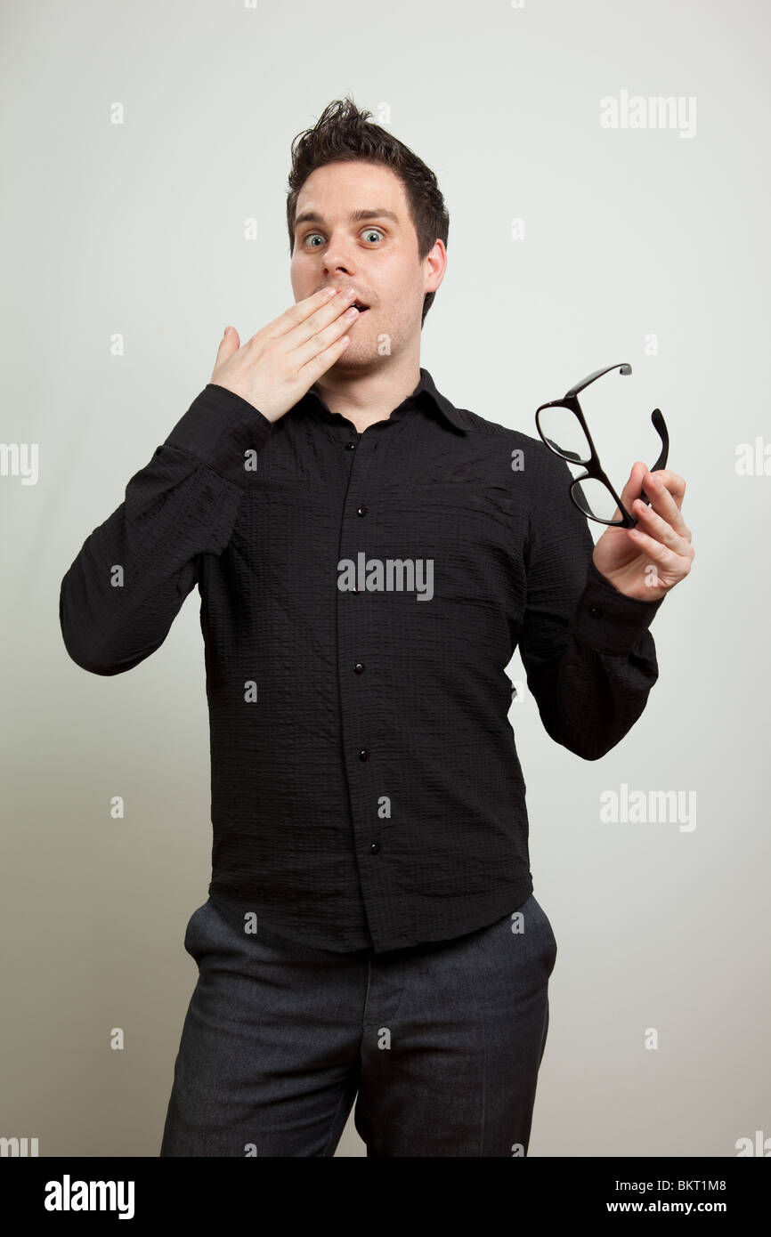 Young man standing Stock Photo - Alamy