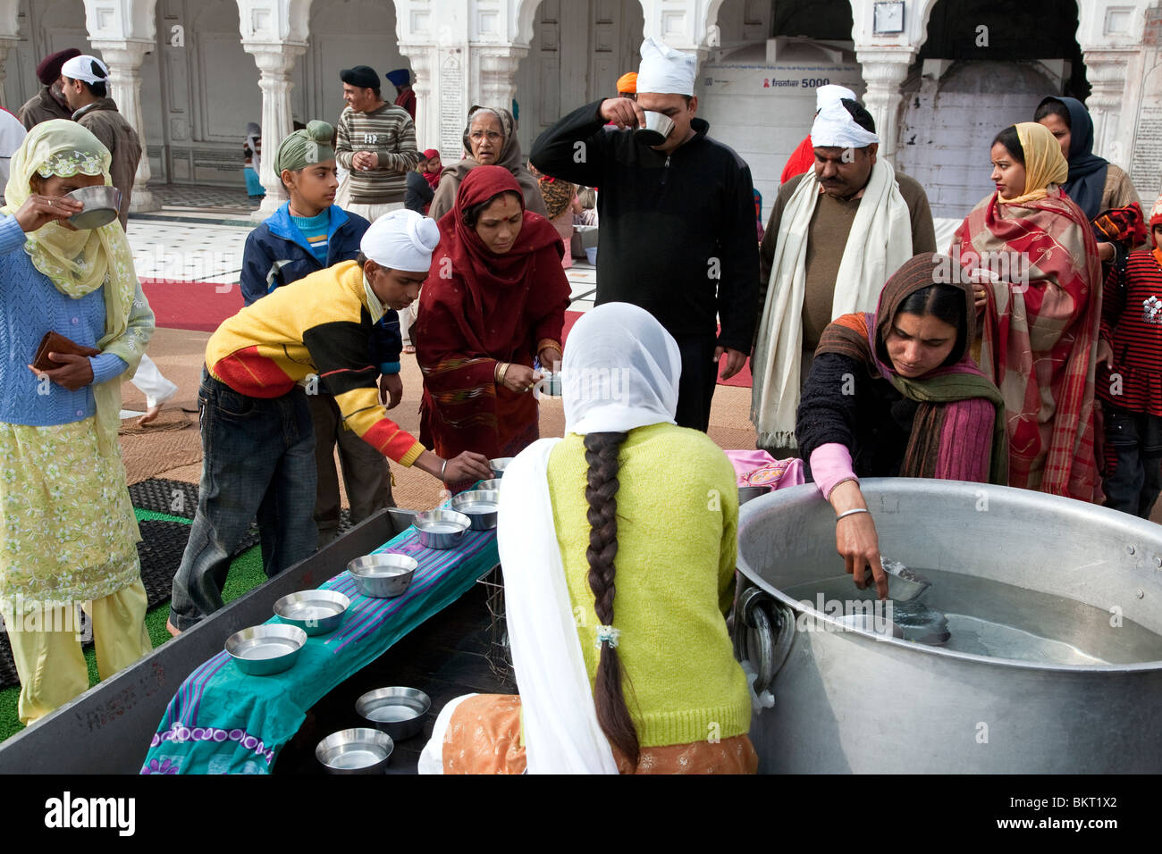 Sikh devotees drinking water. The Golden Temple. Amritsar. Punjab ...