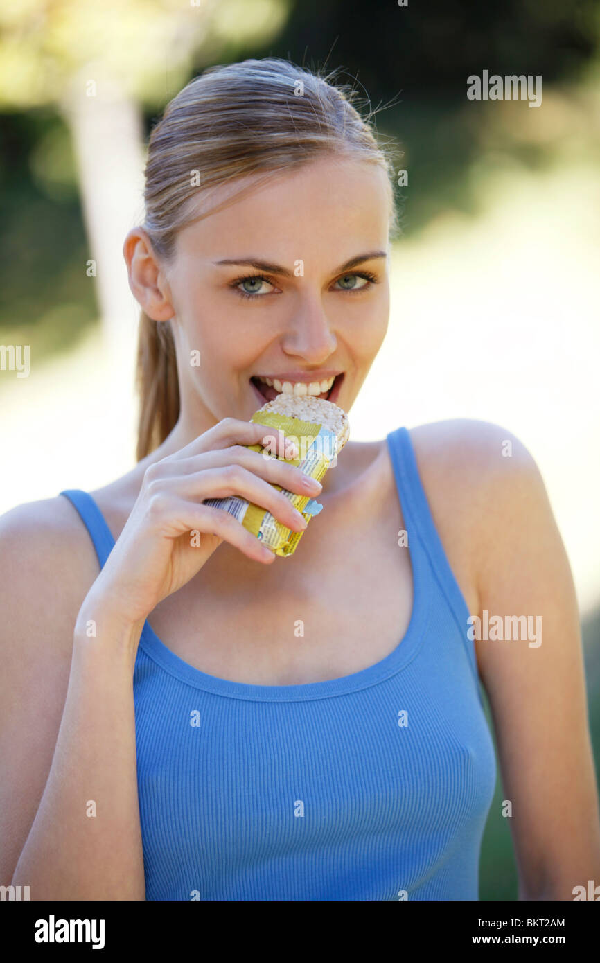 girl eating a snack Stock Photo - Alamy
